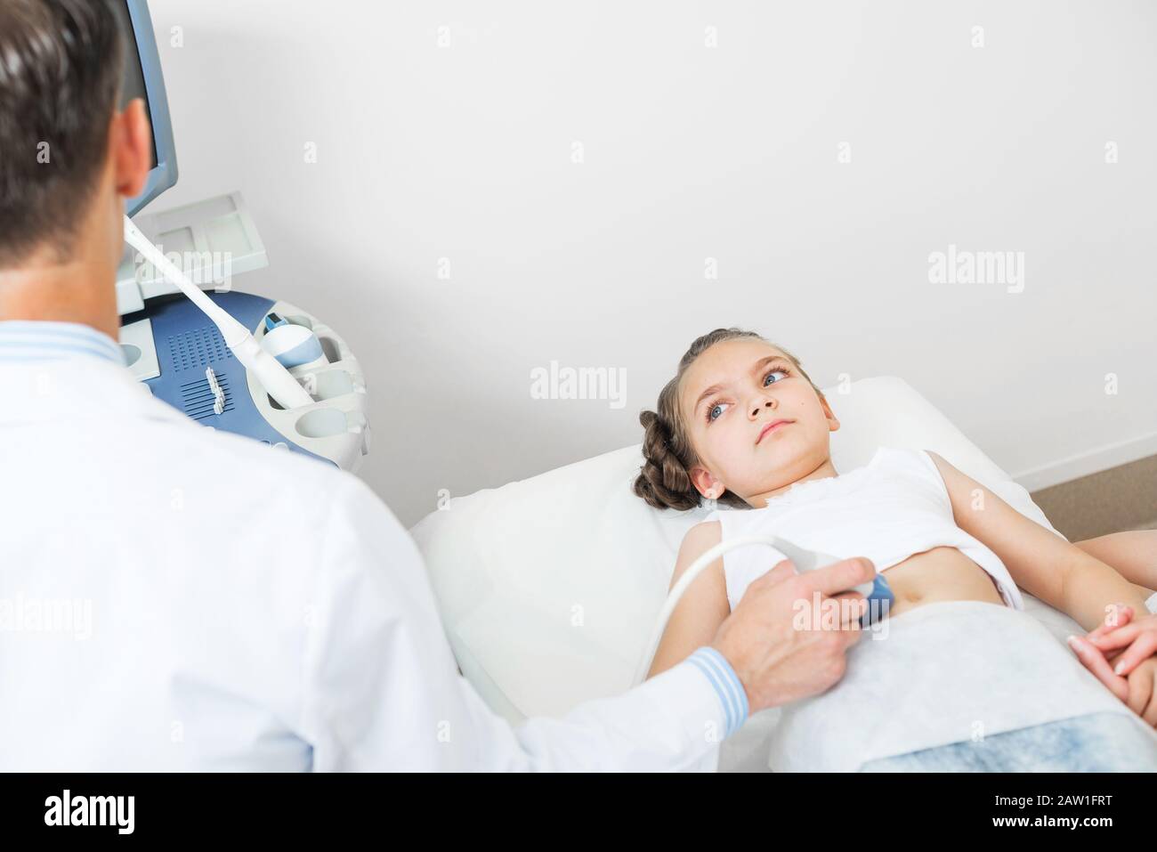 Medical procedure of smiling little girl Stock Photo - Alamy