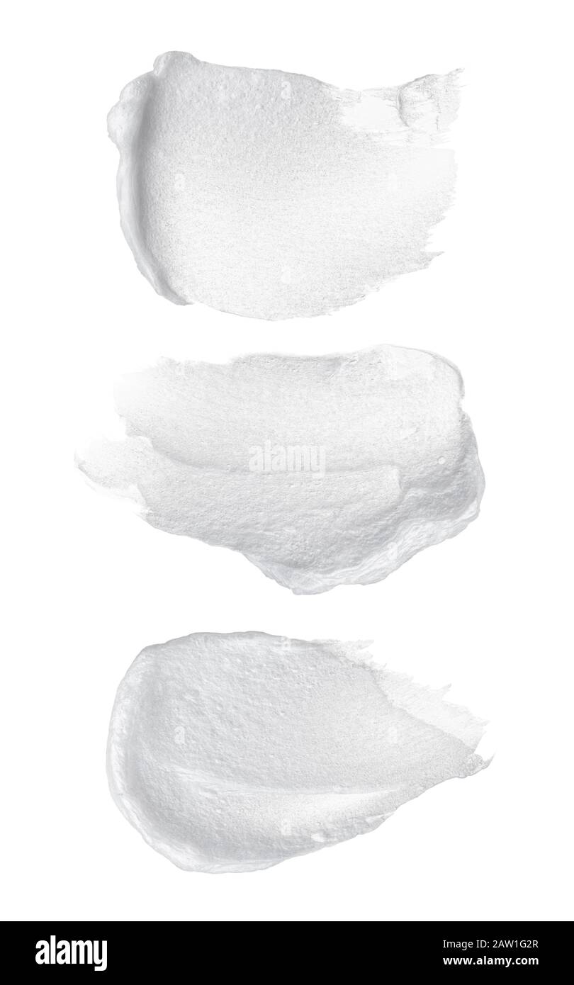 White smear of cosmetic cream or white acrylic paint isolated on white ...