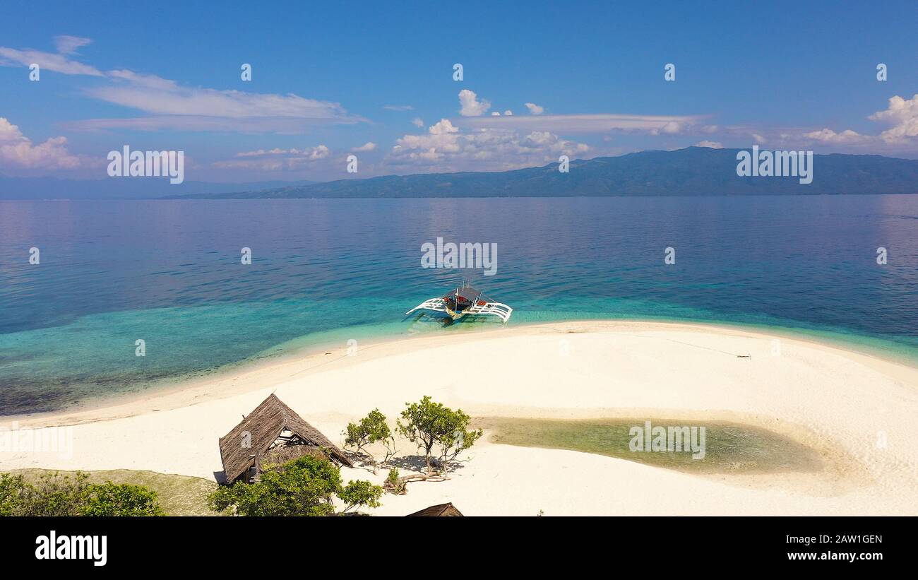 Perfect white sand beach and boat. Tranquil beach scenery. Summer ...