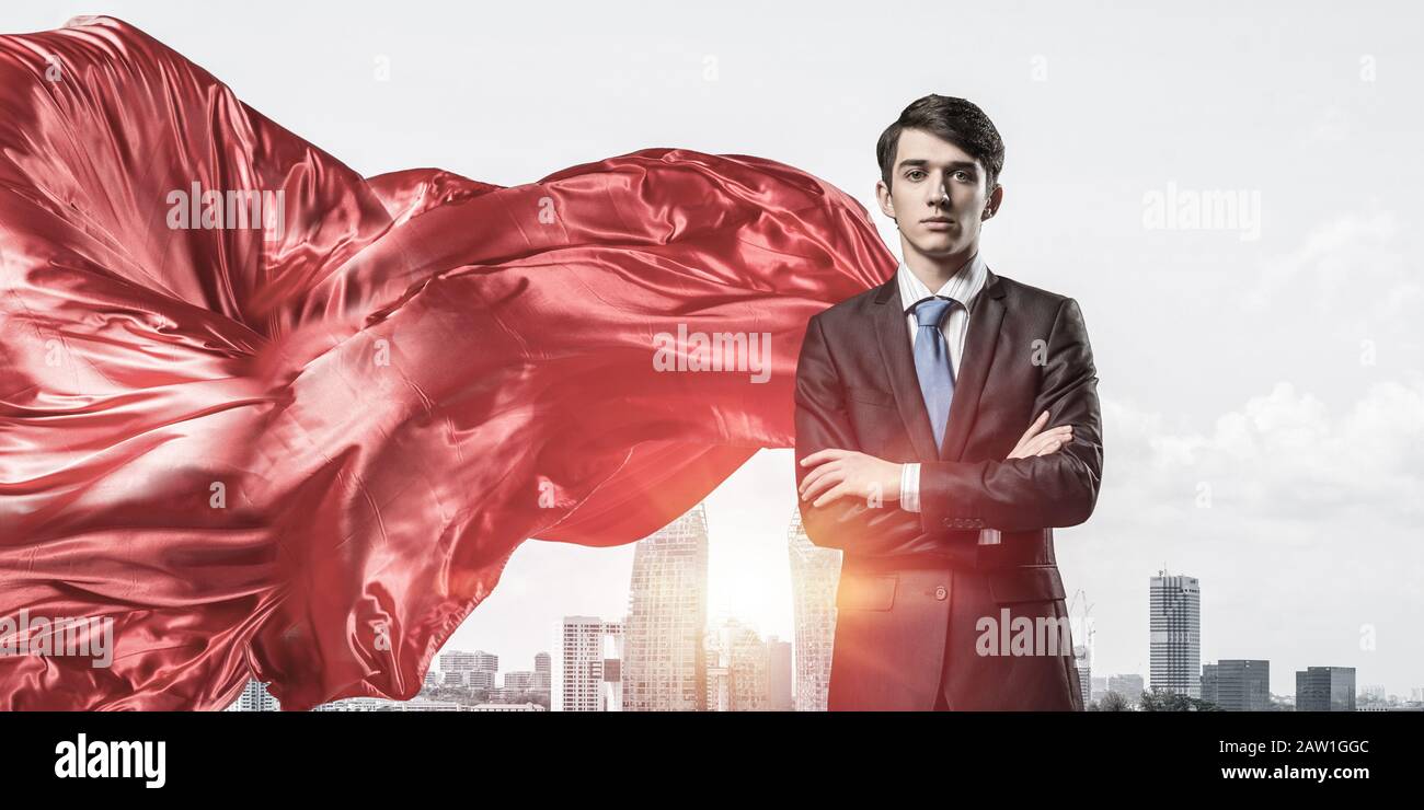 Concept of power and sucess with businessman superhero in big city ...