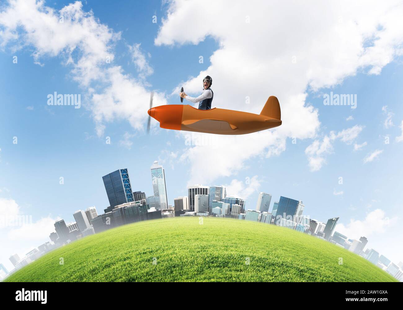 Screaming businessman in leather helmet flying Stock Photo - Alamy