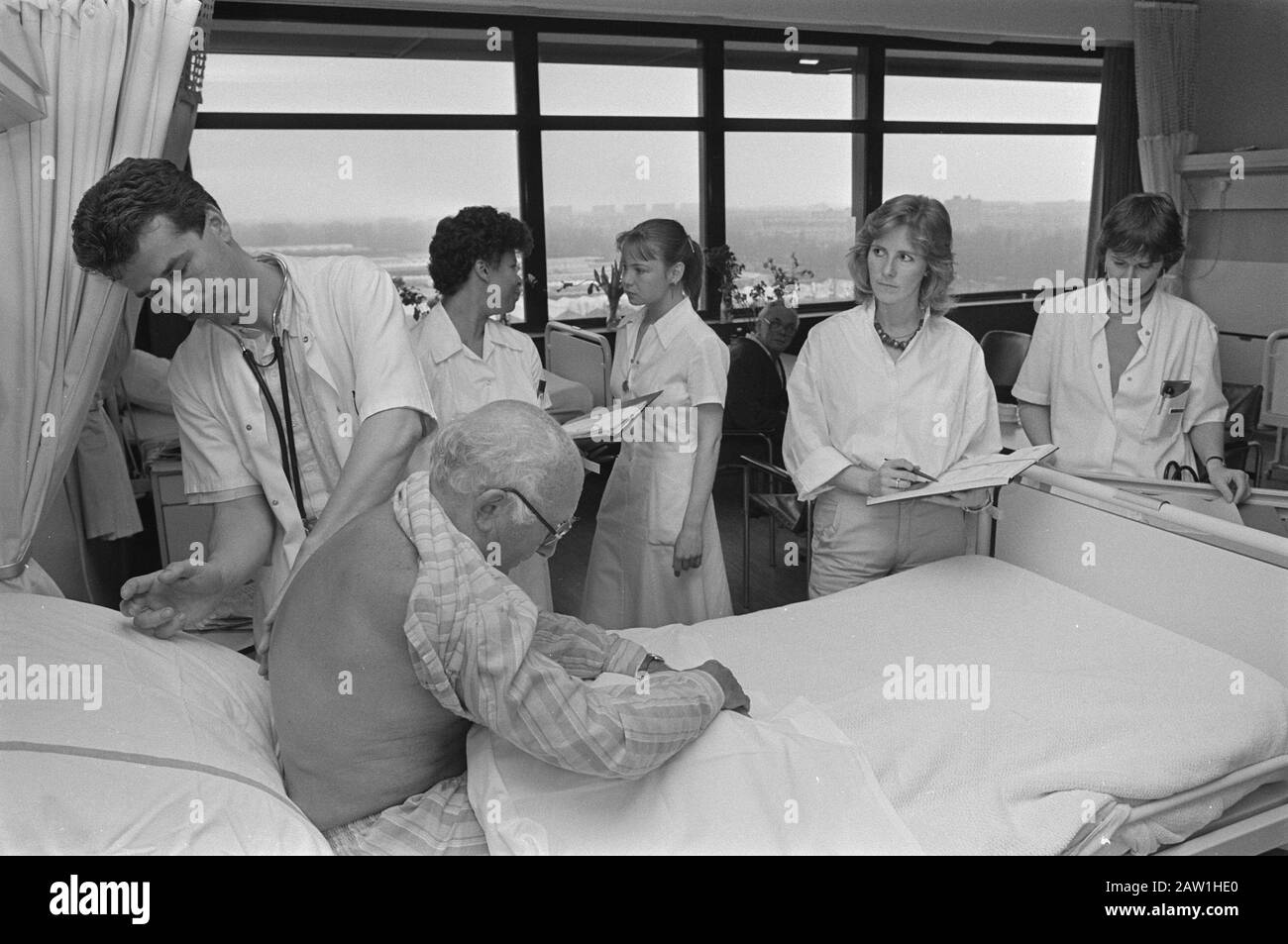 Mission Magazine Hospital; doctors and nurses examining a patient at ...
