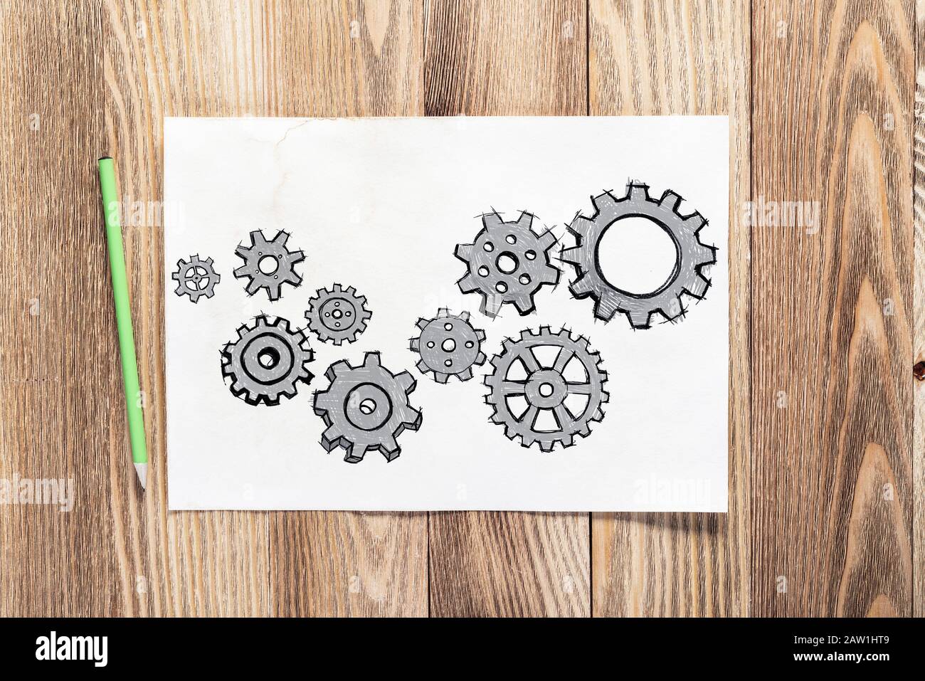 Cogwheels hand drawn illustration on paper sheet Stock Photo - Alamy