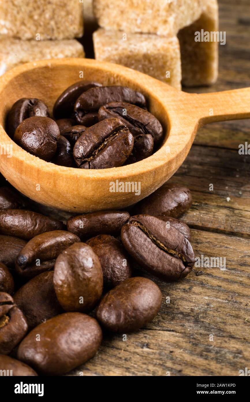 Closeup photo of coffee beans with cane sugar Stock Photo - Alamy