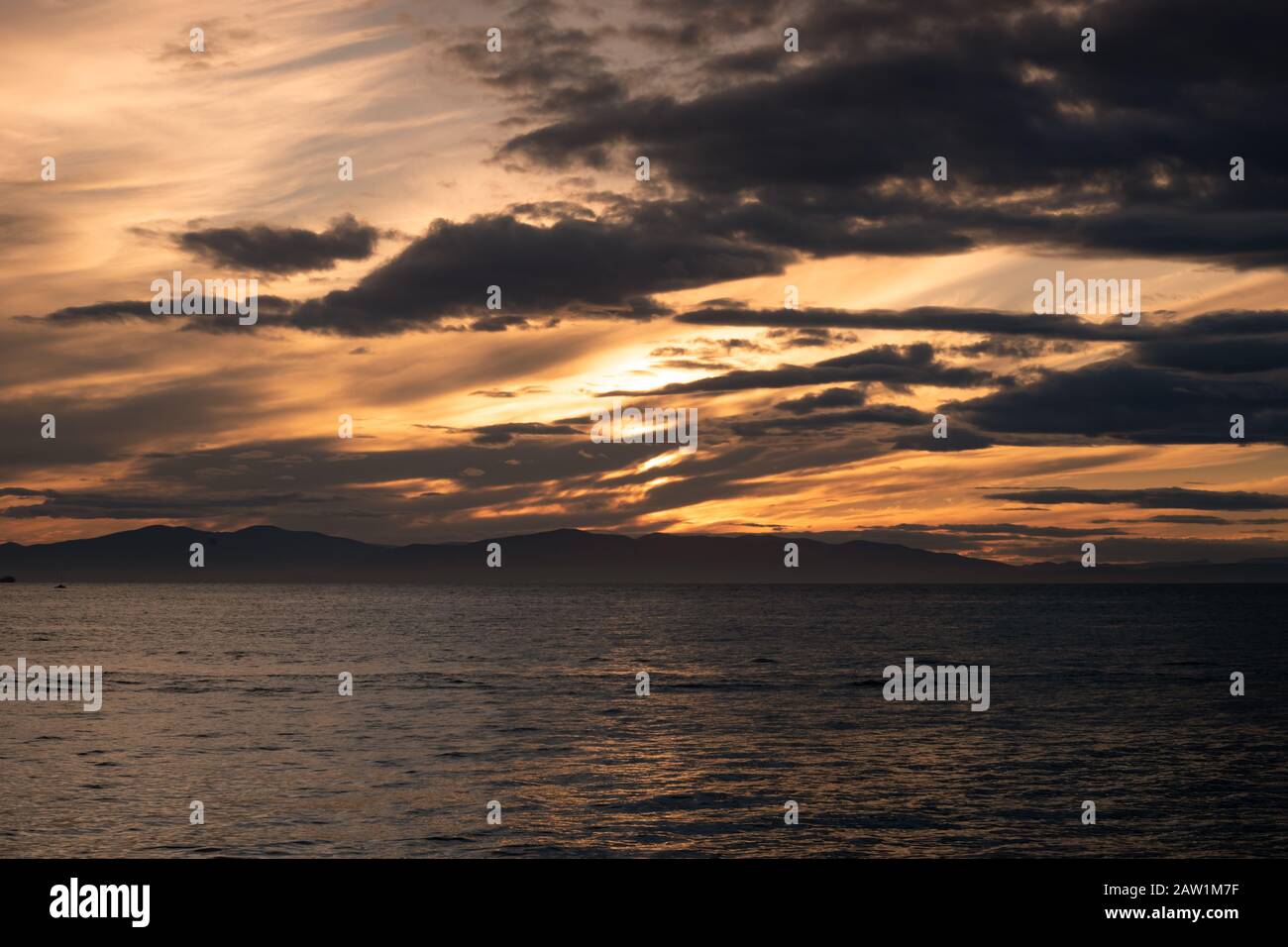 Sunset over dramatic background hi-res stock photography and images - Alamy
