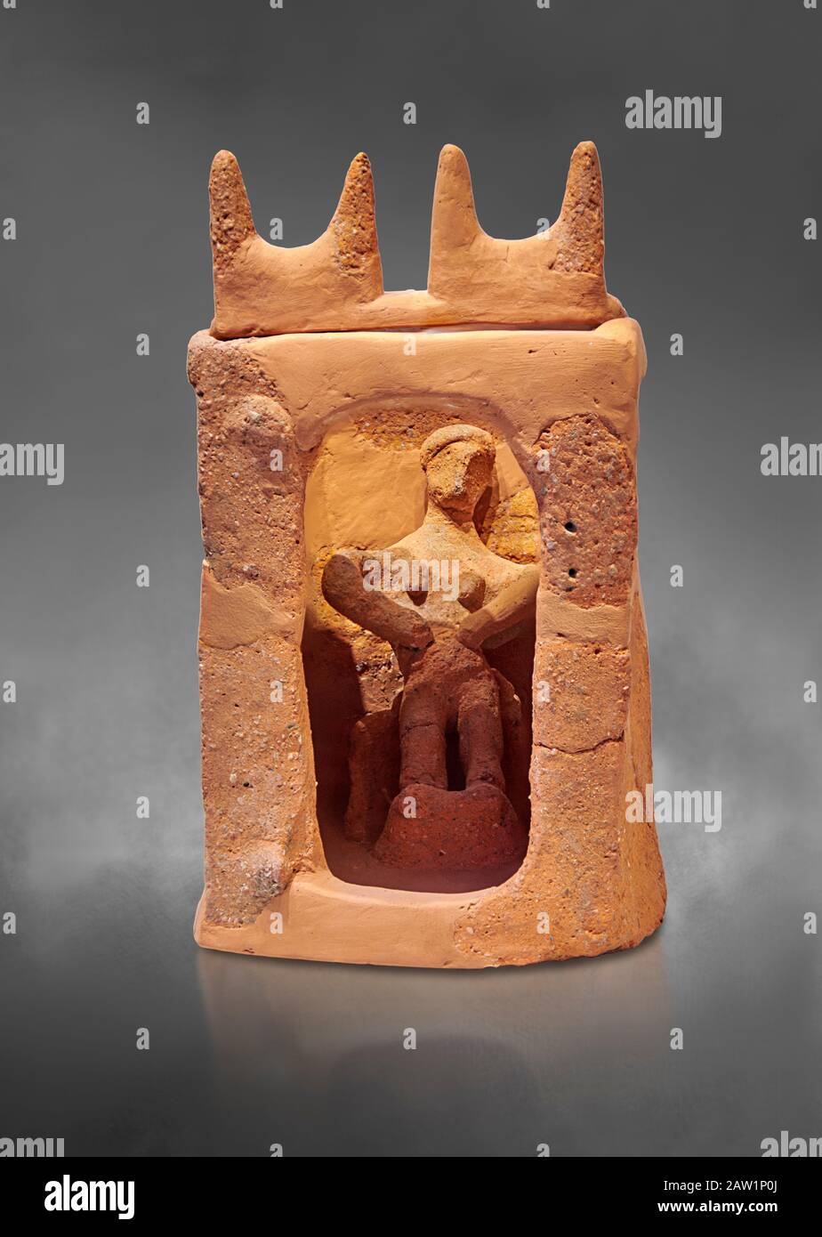 Minoan clay model shrine depicting a priestess playing the part of a ...