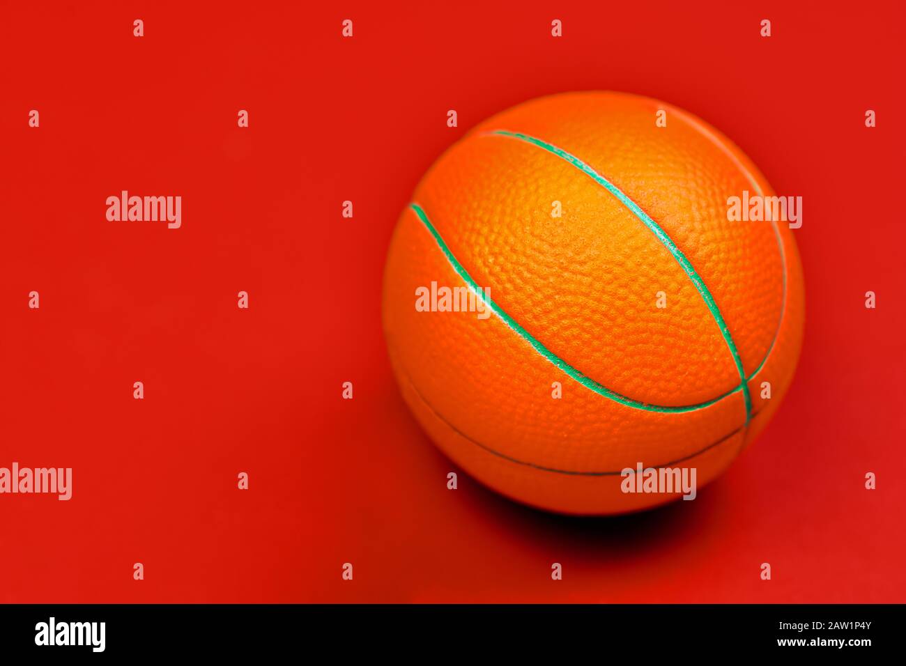 Basketball ball, red background, copy space. Spherical ball used in ...