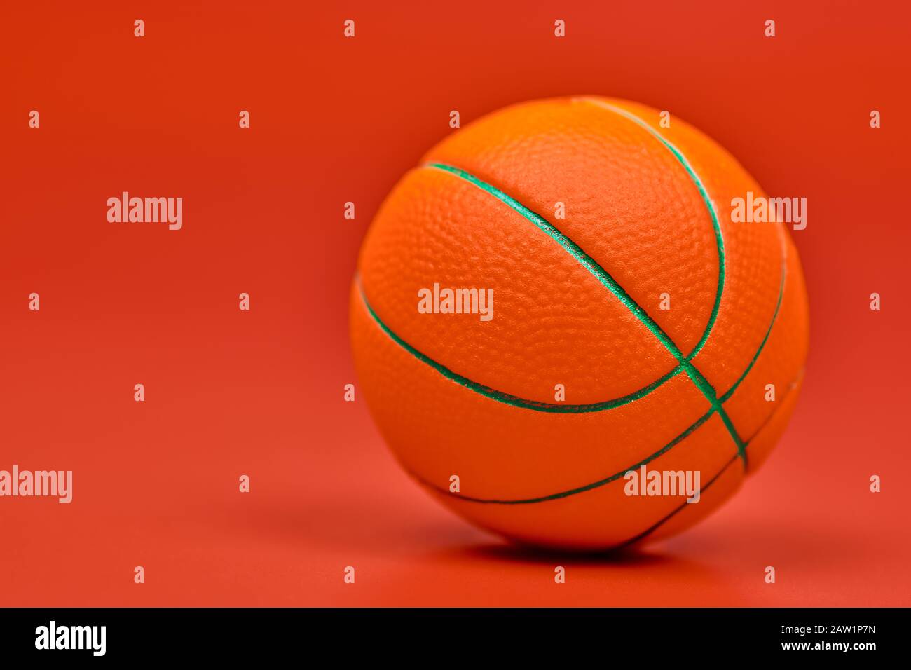 Basketball ball, red background, copy space. Spherical ball used in ...