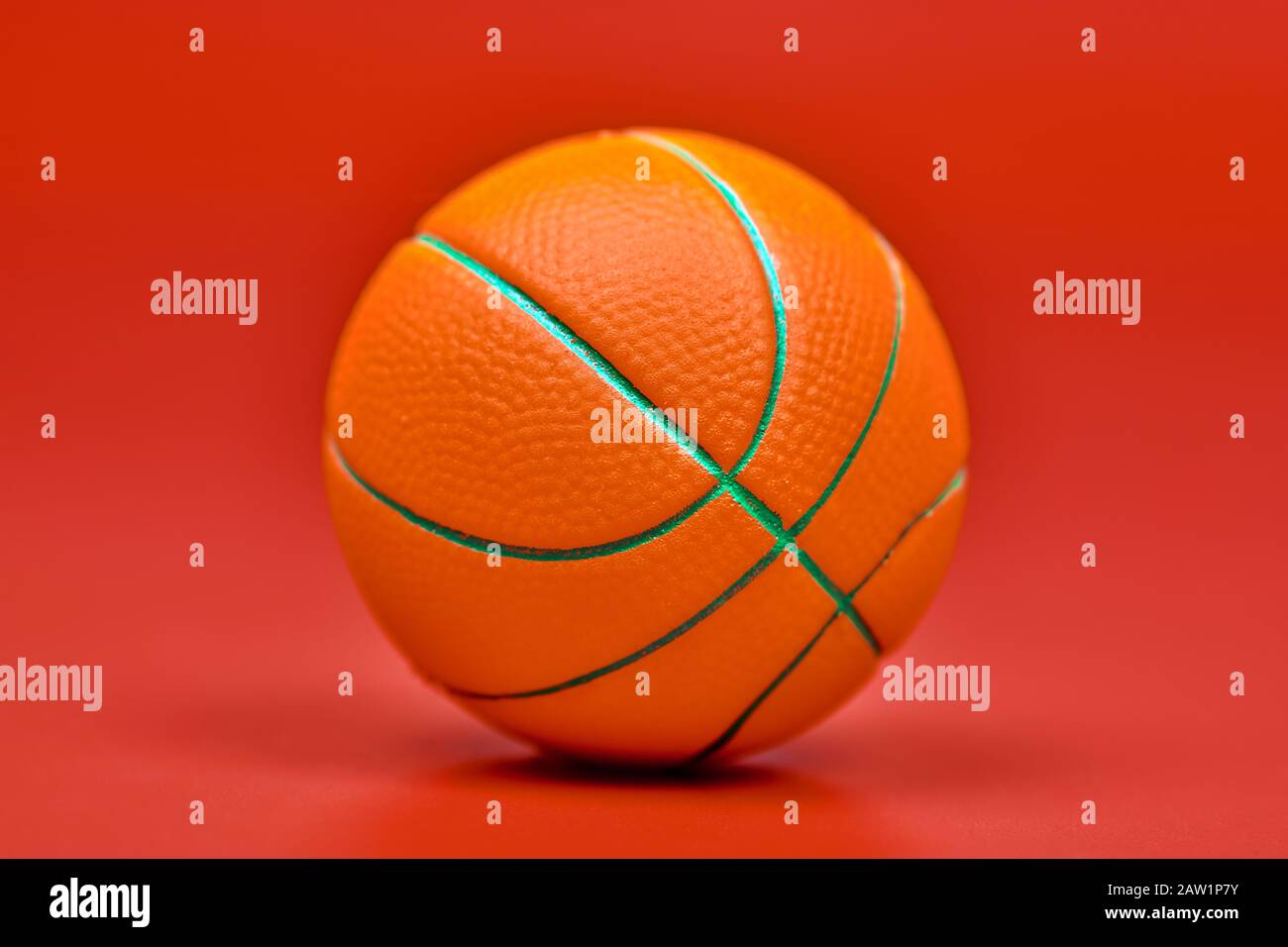 Basketball ball, red background. Spherical ball used in basketball ...