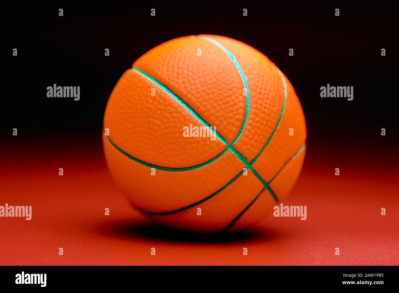 Basketball ball, red background. Spherical ball used in basketball ...