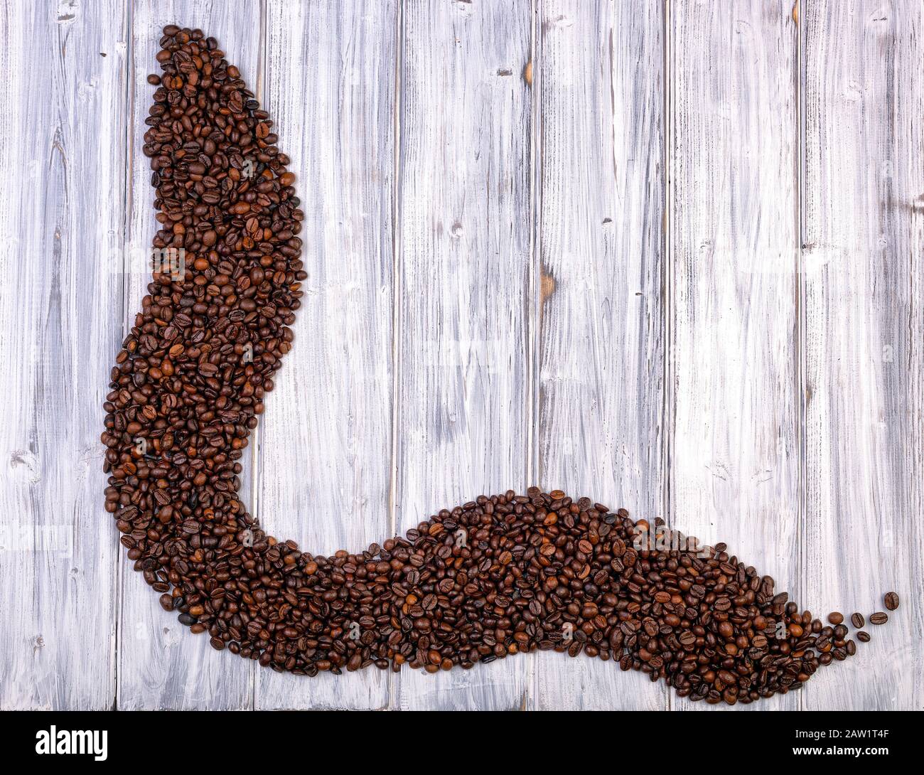 Coffee beans stacked on the white, wooden and old background Stock ...