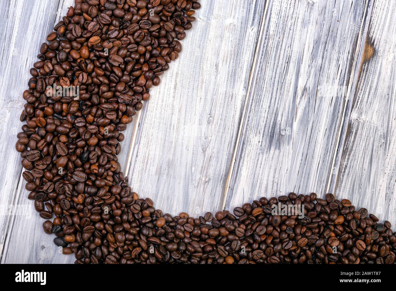 Coffee beans stacked on the white, wooden and old background Stock ...