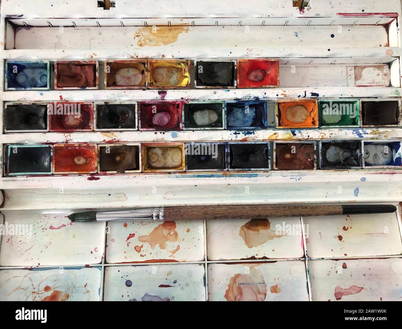 Paintbrush artist palette and multi colored gouache Stock Photo - Alamy