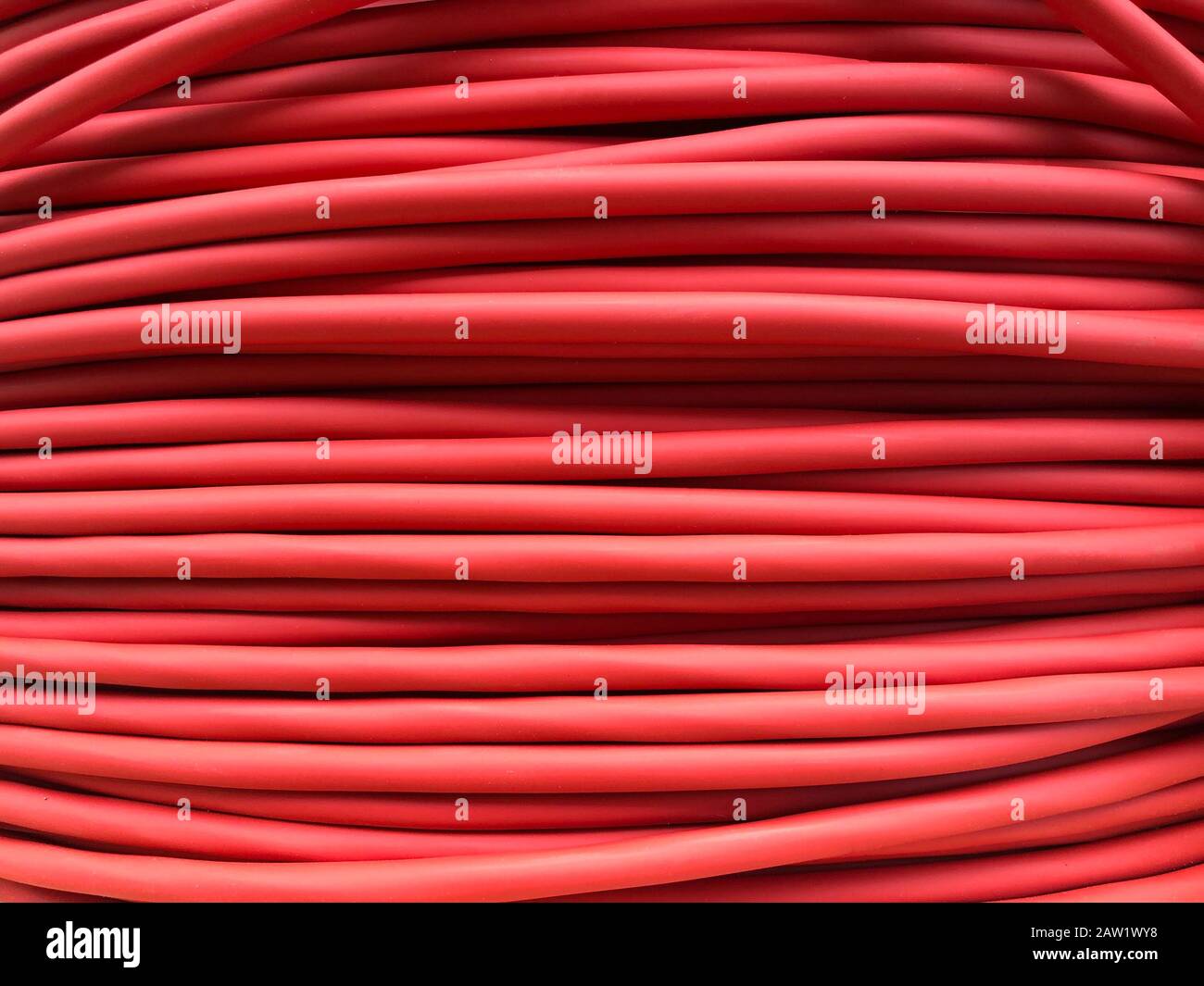 red coiled electrical cable on the wooden spool Stock Photo - Alamy