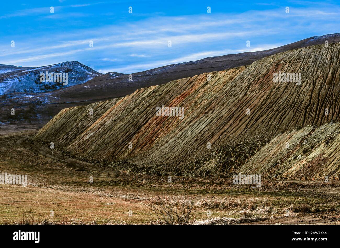 Mountain landscape with a mottled slope of a hill, moving from the wind ...