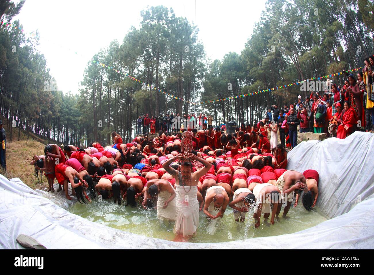 Nepalese women take a part during the month-long Swasthani Bratakatha ...