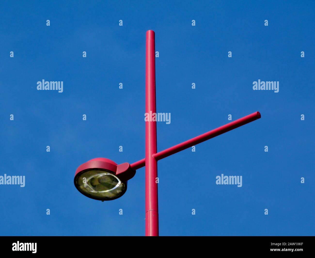 red round halogen street lamp head with glass lens. blue sky. low angle ...