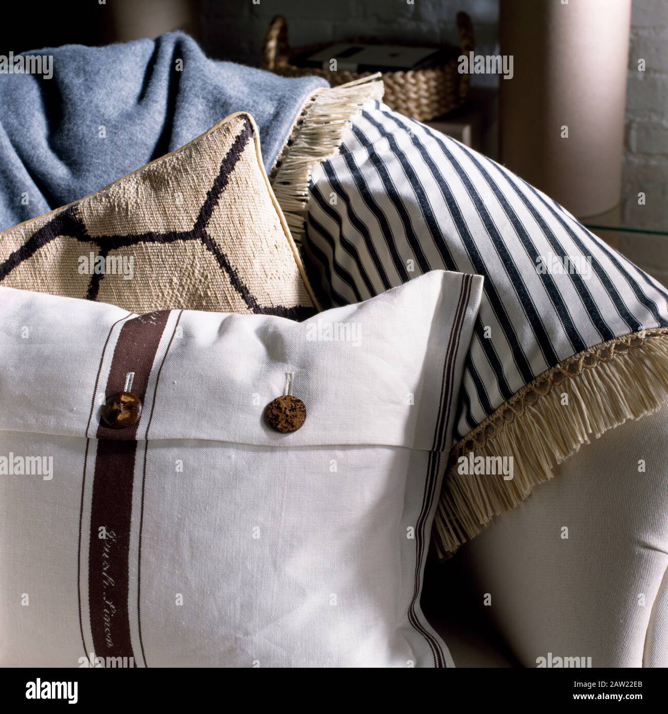 Close-up of a cushion made from a white linen tea towel with a striped ...