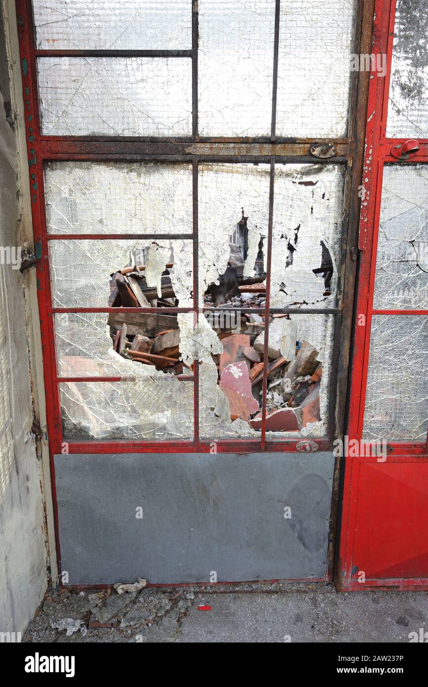 Hole in Tempered Safety Glass Damaged Door Stock Photo - Alamy