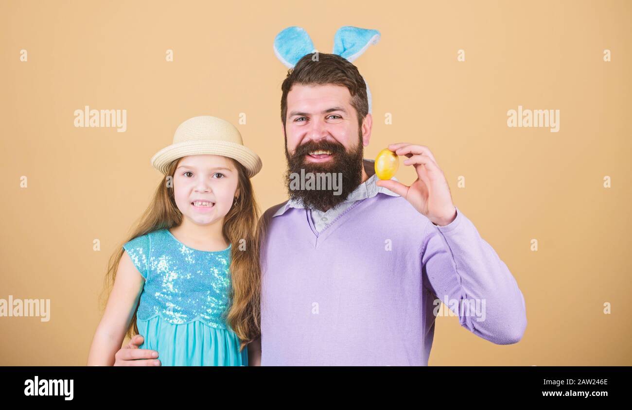 Enjoying the big day. Happy father and child with colored Easter eggs ...