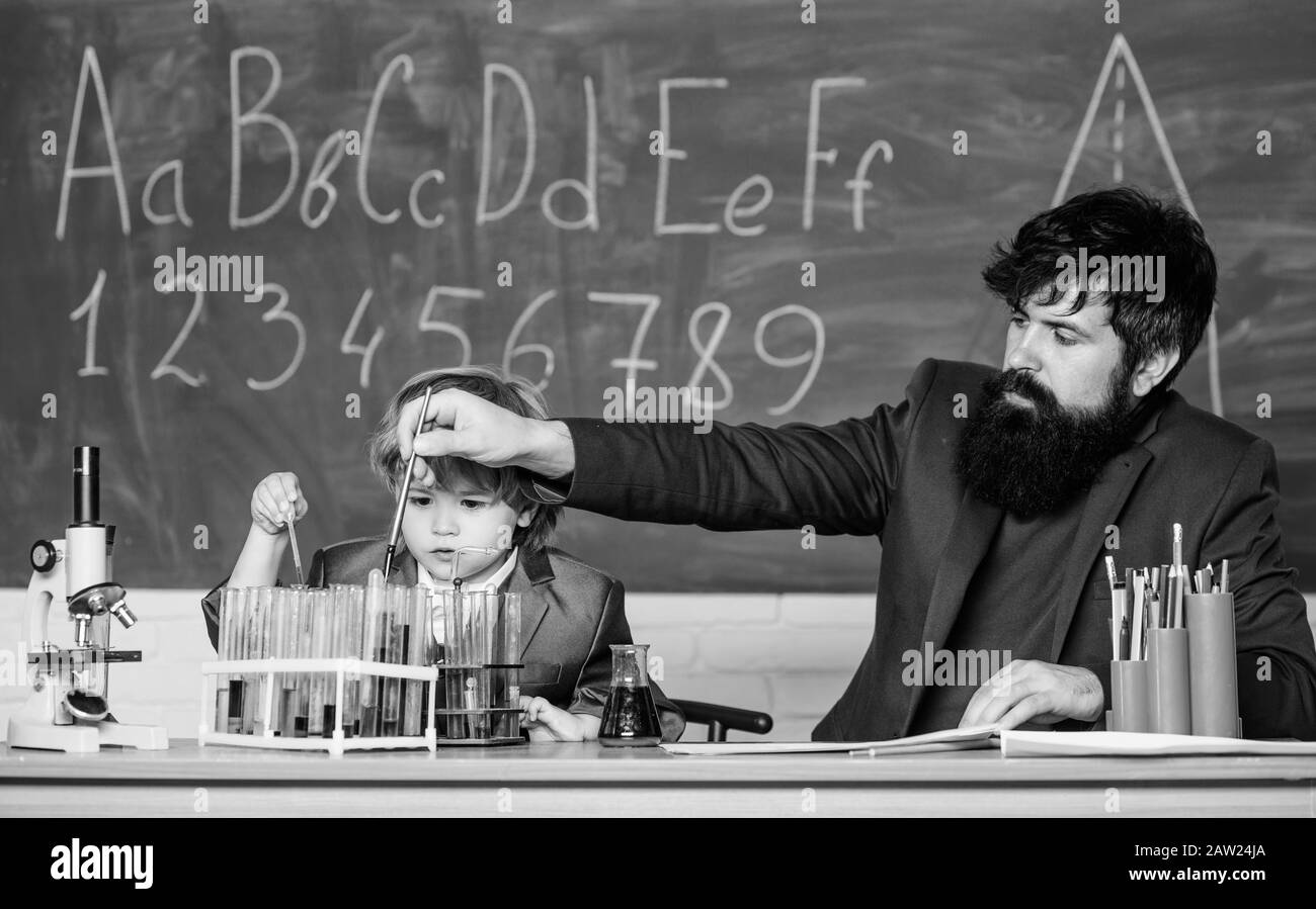 biotechnology research concept. son and father at school. Formula ...