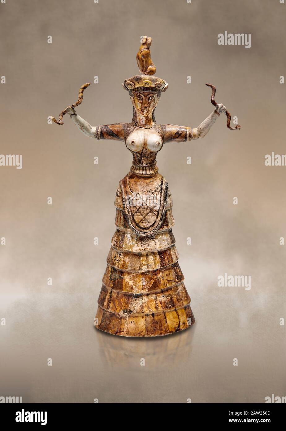 Minoan Snake Goddess statue arms raised holding 2 snakes from the ...