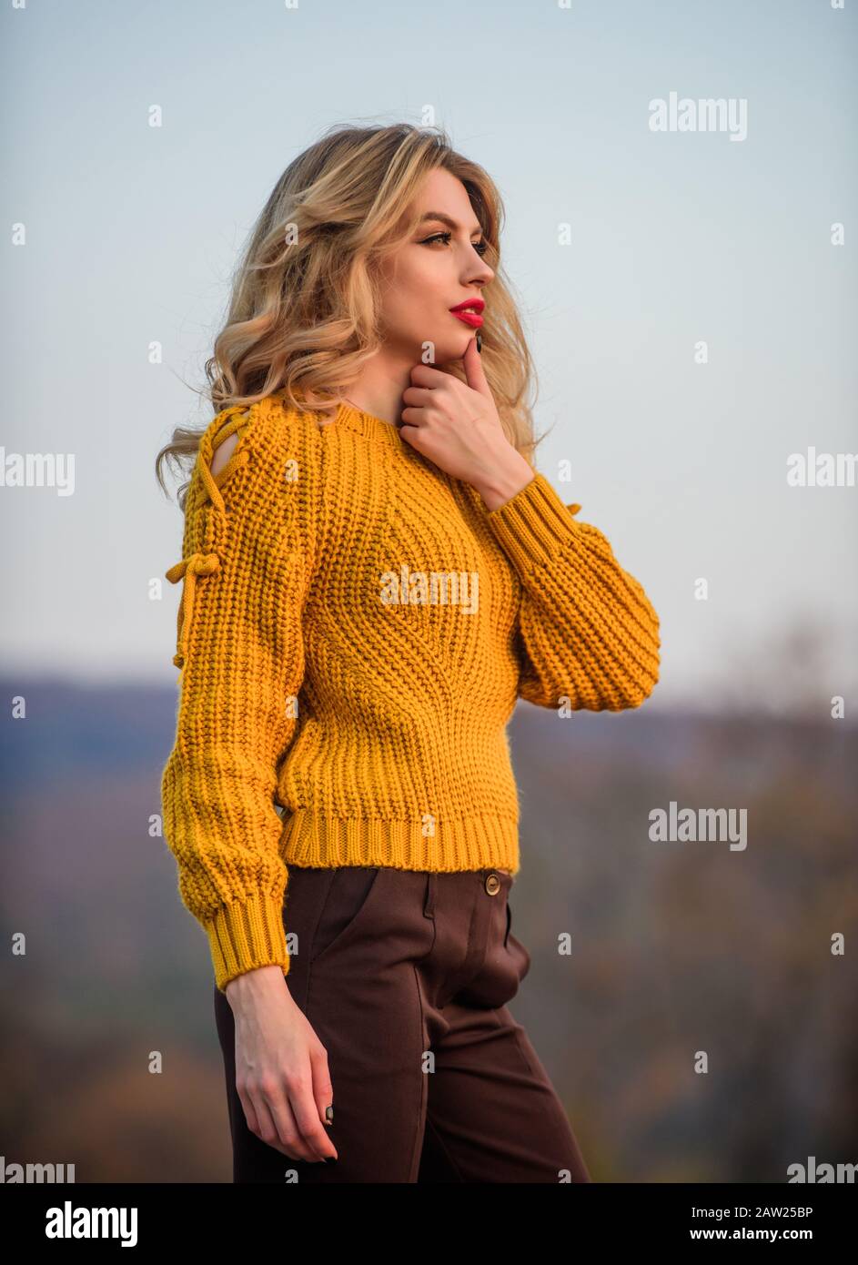 Style is all about balance. Gorgeous lady feeling cozy in woolen ...