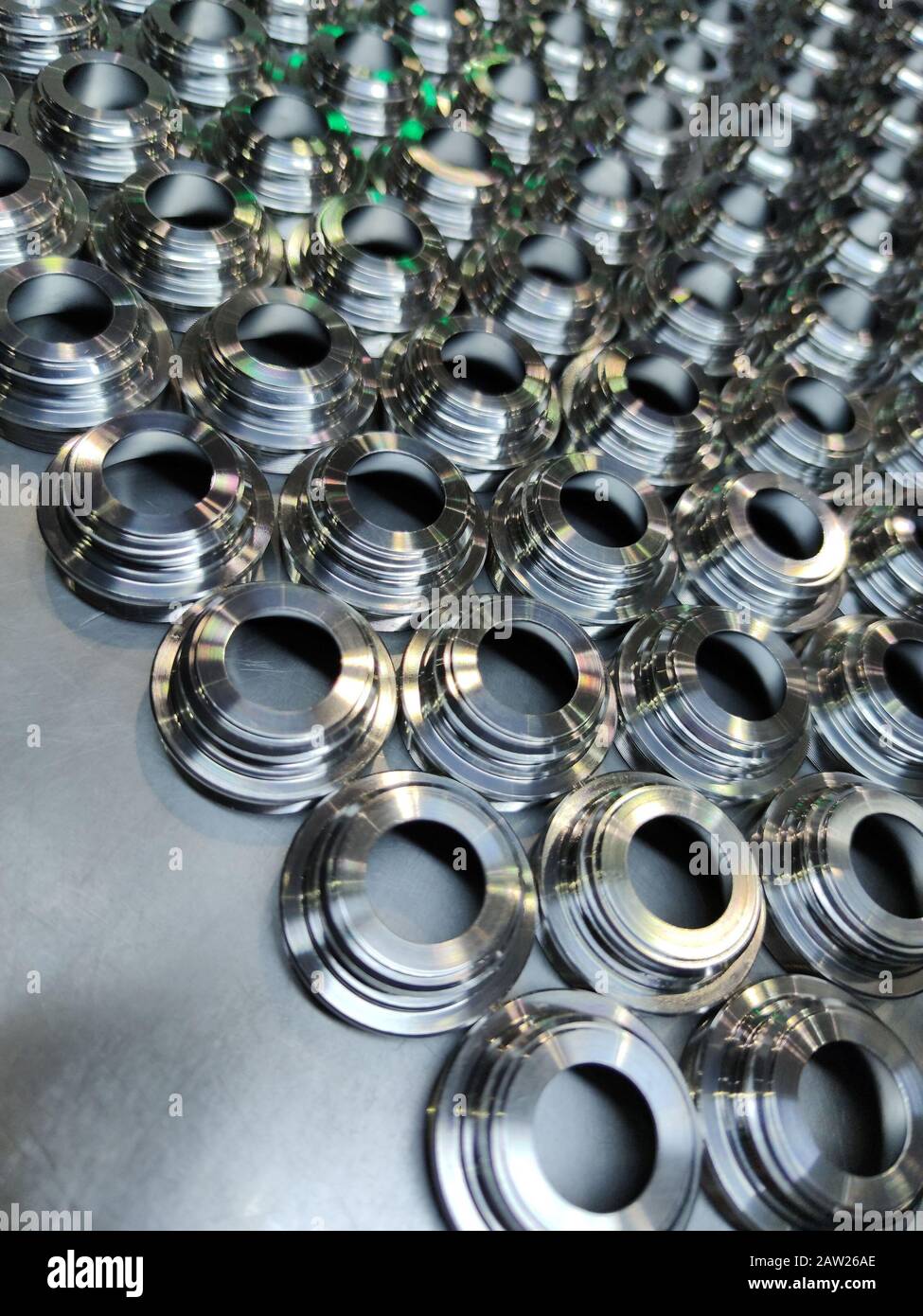 Shiny steel parts background. An edge of metal cnc turning production ...