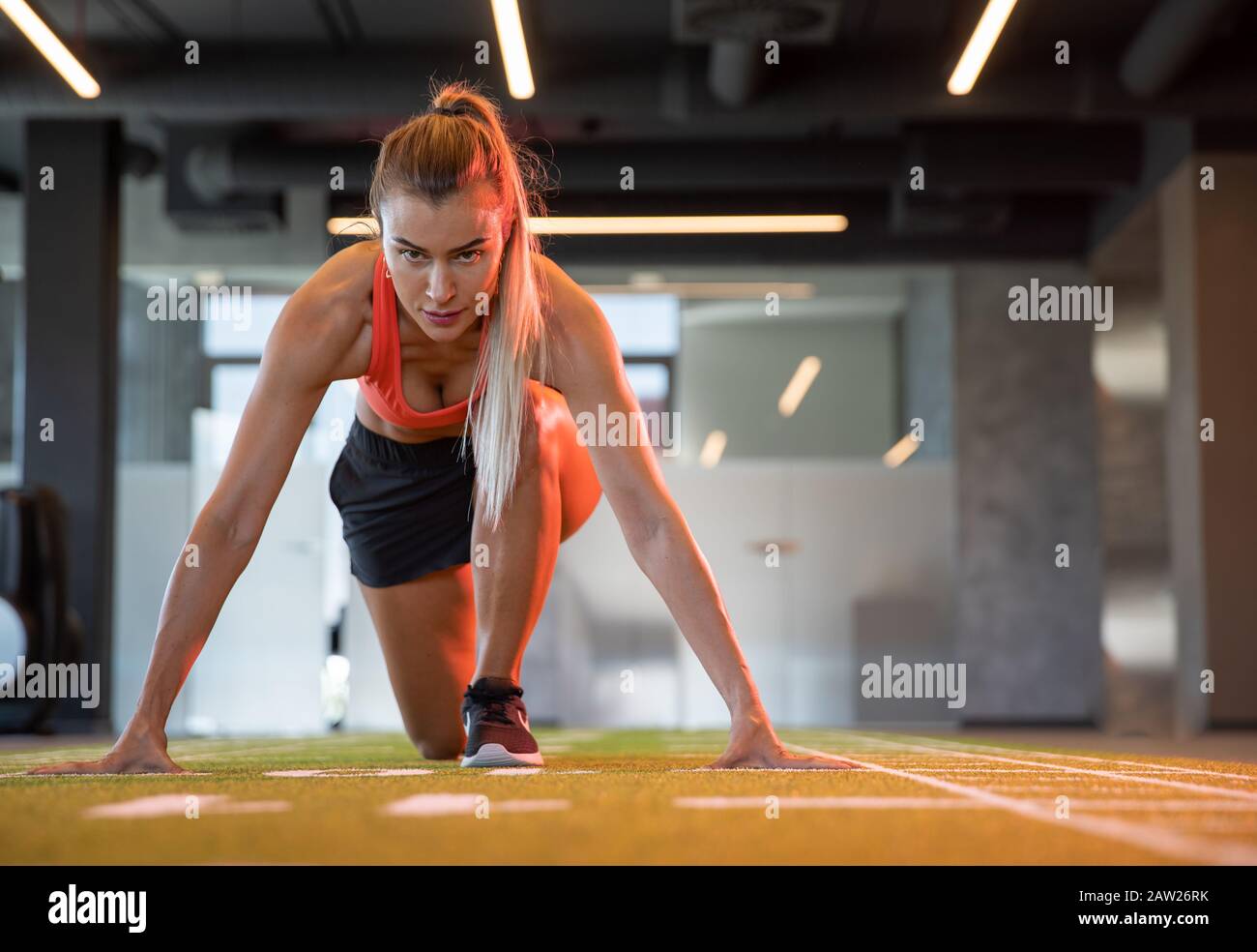 young athlete ready to start at starting position Stock Photo - Alamy