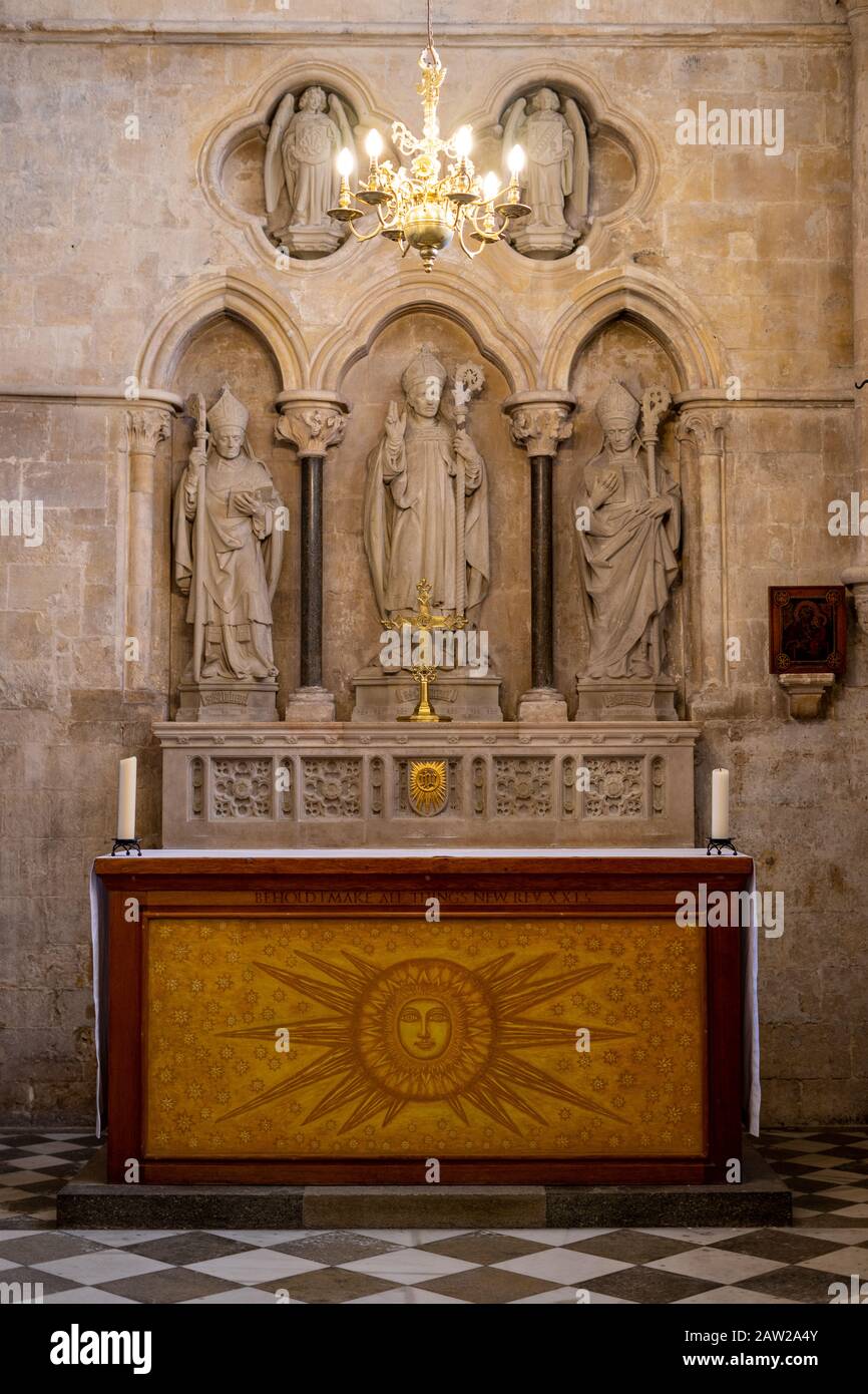 An altar inside Chichester cathedral with stonework behind it Stock ...