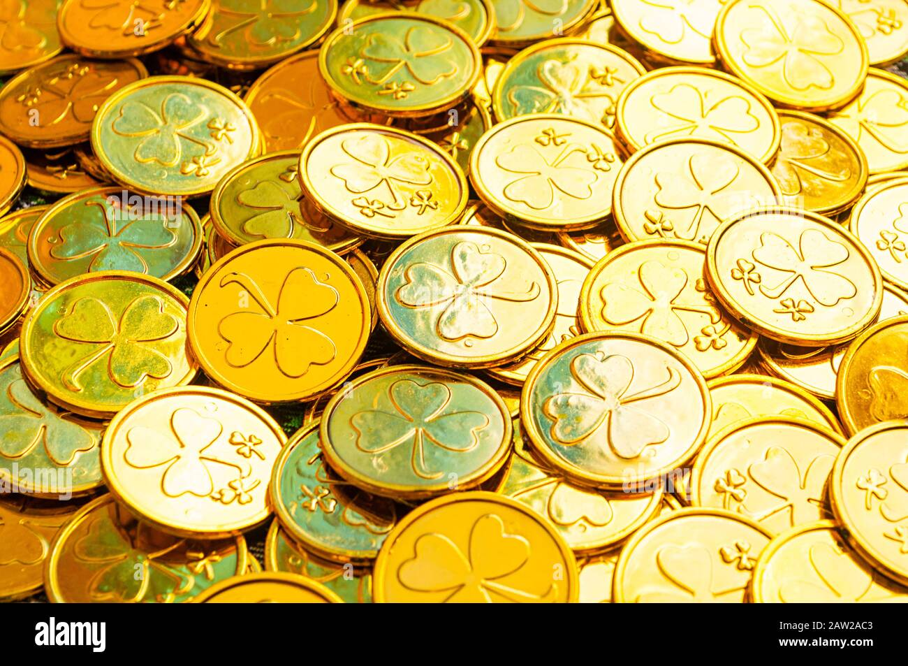 St Patrick's Day background. Golden coins with shamrock under soft ...