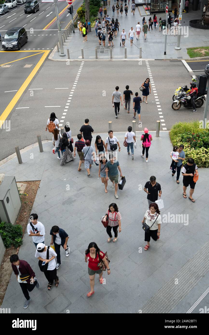 Singapore. January 2020. The traffic in Orchard Road and the crowd on ...
