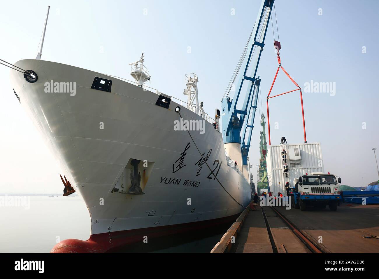 Parts of a Long March 5B (CZ-5B) carrier rocket are loaded onto a ship ...