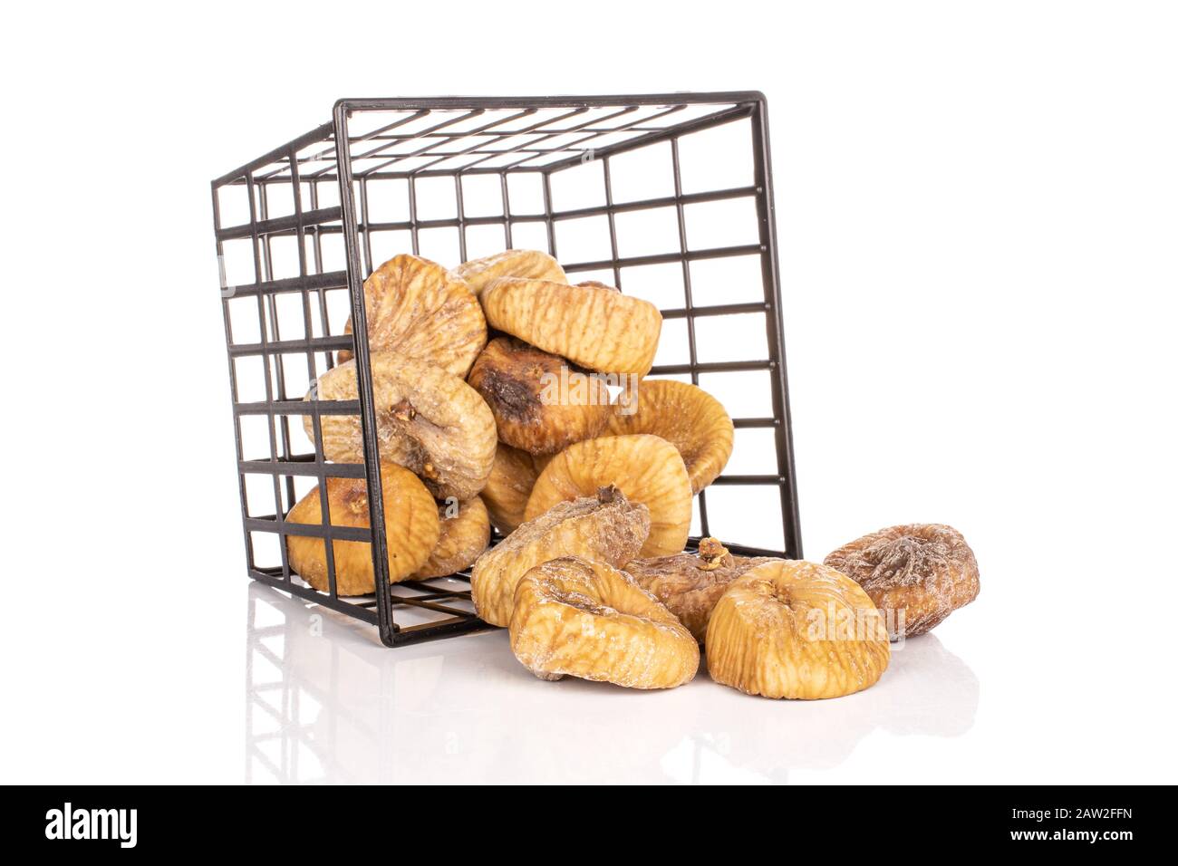 Lot of whole dried fig in black plastic basket isolated on white ...