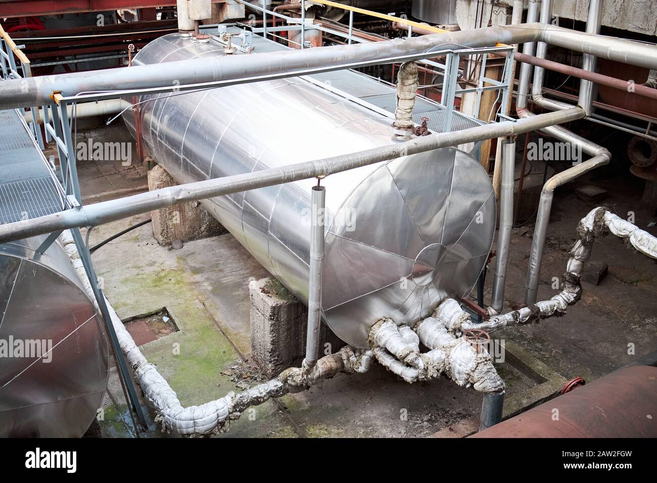 Horizontal storage tank storage barrel of chemical plant surrounded by ...