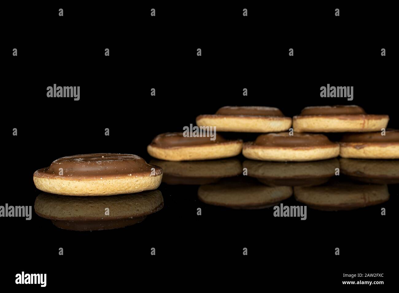 Group of six whole chocolate biscuit isolated on black glass Stock ...