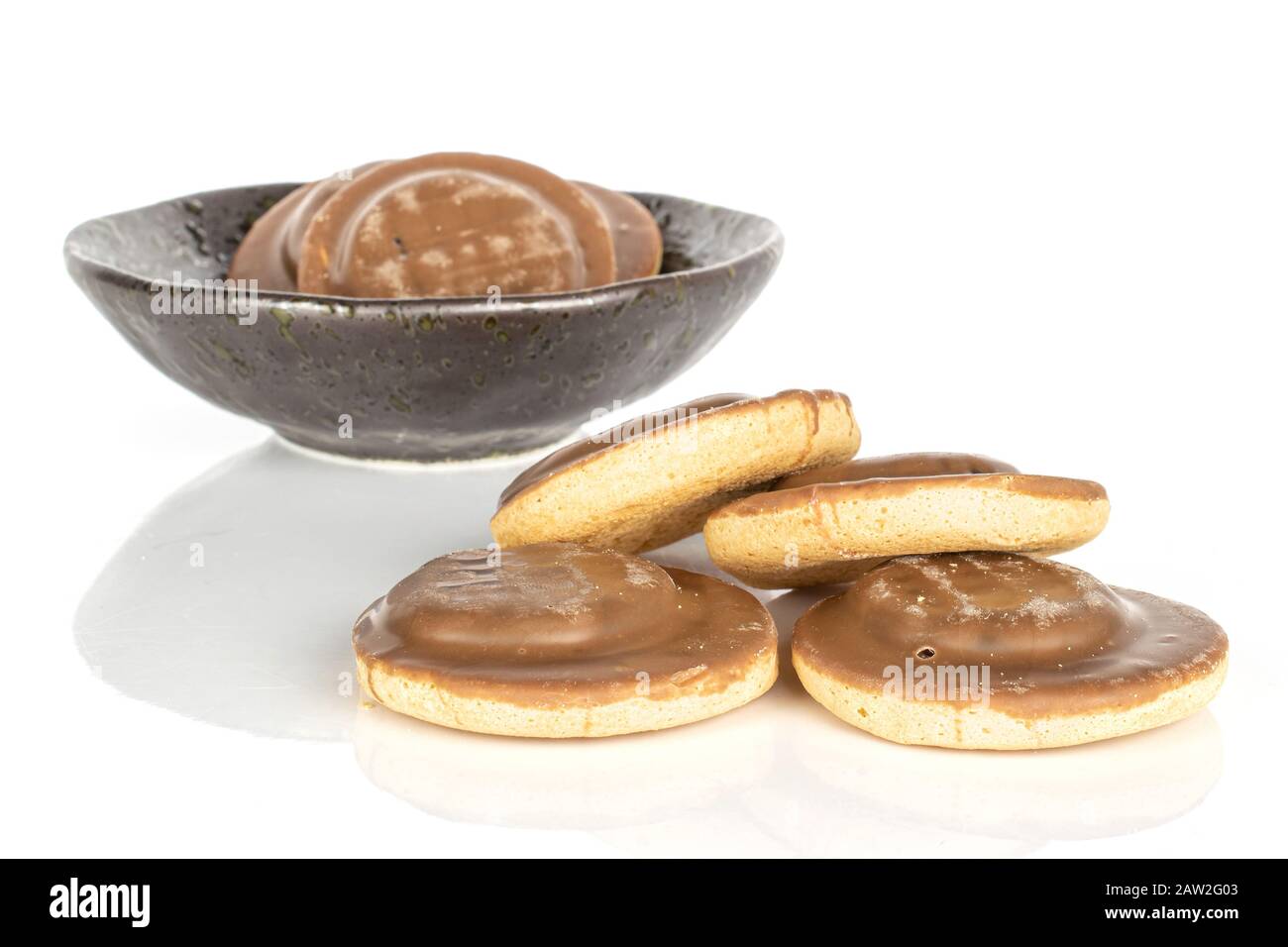 Lot of whole chocolate biscuit in glazed bowl isolated on white ...