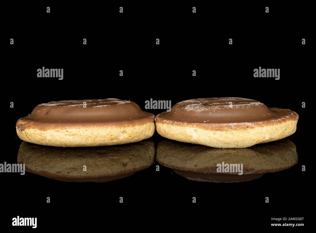 Group of two whole chocolate biscuit isolated on black glass Stock ...