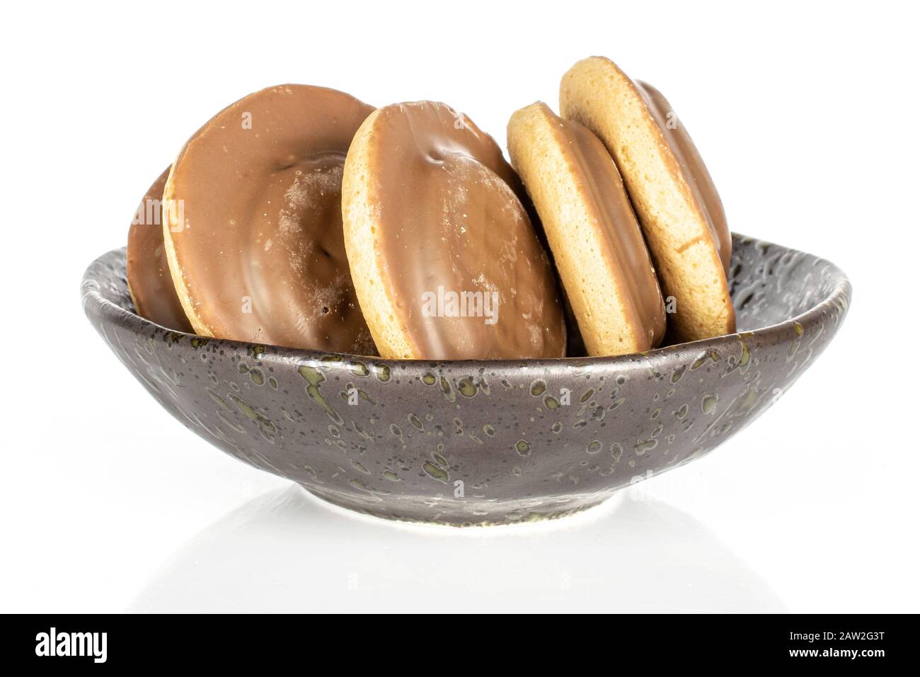 Group of five whole chocolate biscuit in glazed bowl isolated on white ...