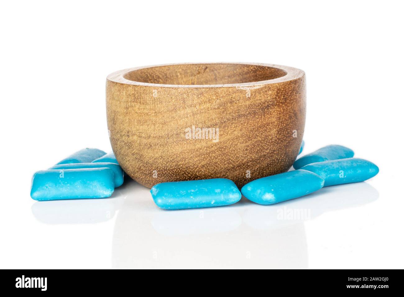 Lot of whole light blue chewing gum in bamboo bowl isolated on white ...
