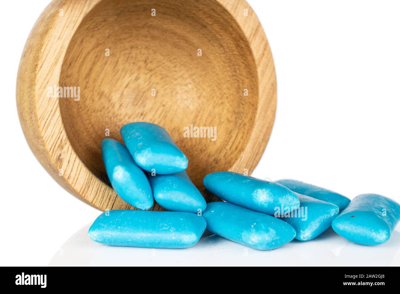 Lot of whole blue chewing gum in bamboo bowl isolated on white ...