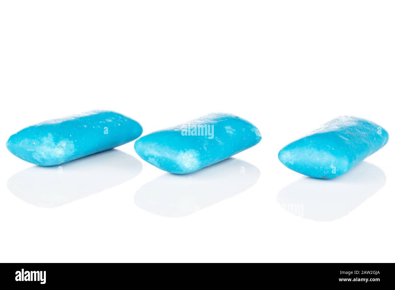 Group of three whole blue chewing gum isolated on white background ...
