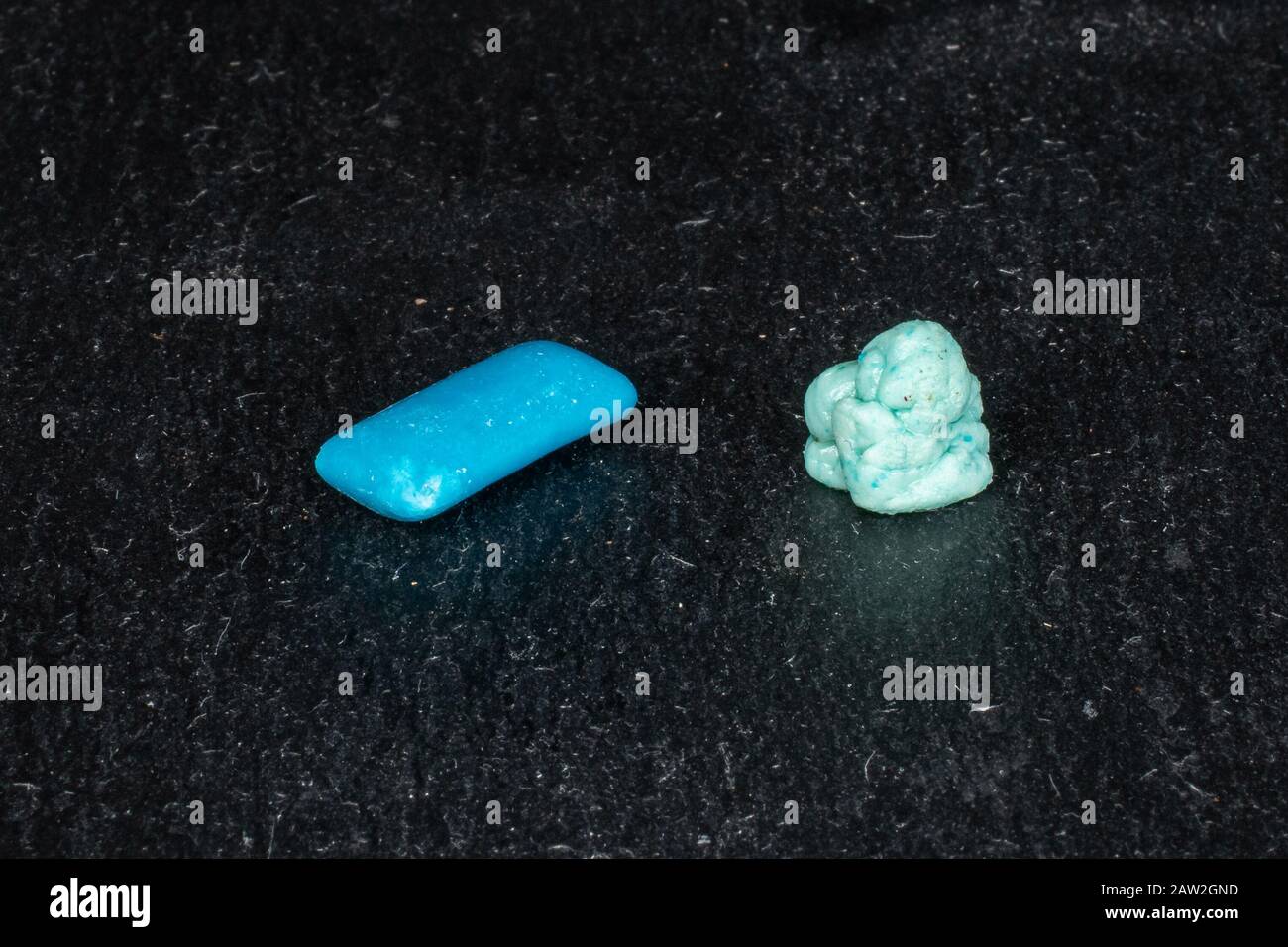 One whole blue chewing gum with bolus on grey stone Stock Photo - Alamy