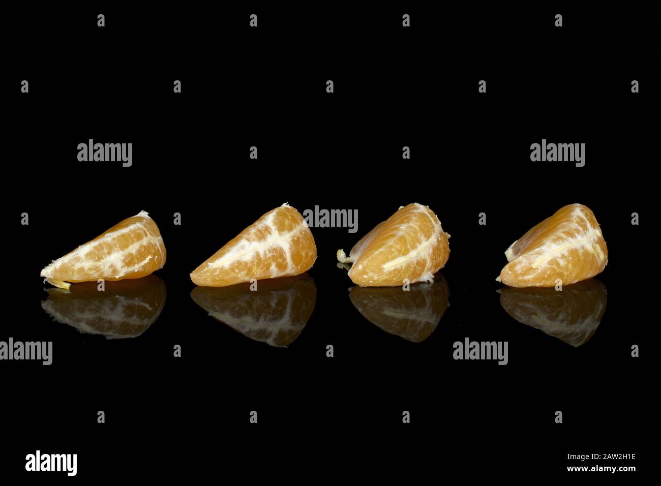 Group of four pieces of peeled fresh orange mandarin line isolated on ...