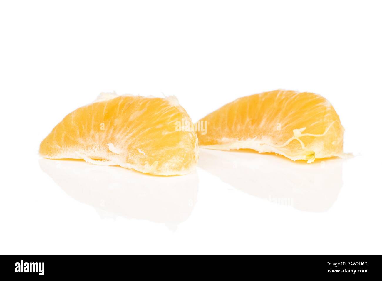 Group of two pieces of peeled fresh orange mandarin isolated on white ...