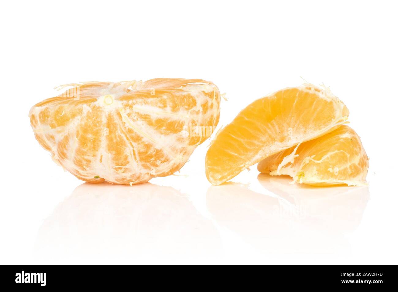 Group of one half two pieces of peeled fresh orange mandarin isolated ...