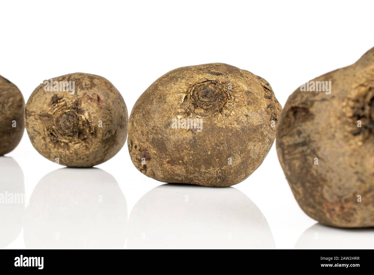 Group of four whole raw sweet beetroot isolated on white background ...