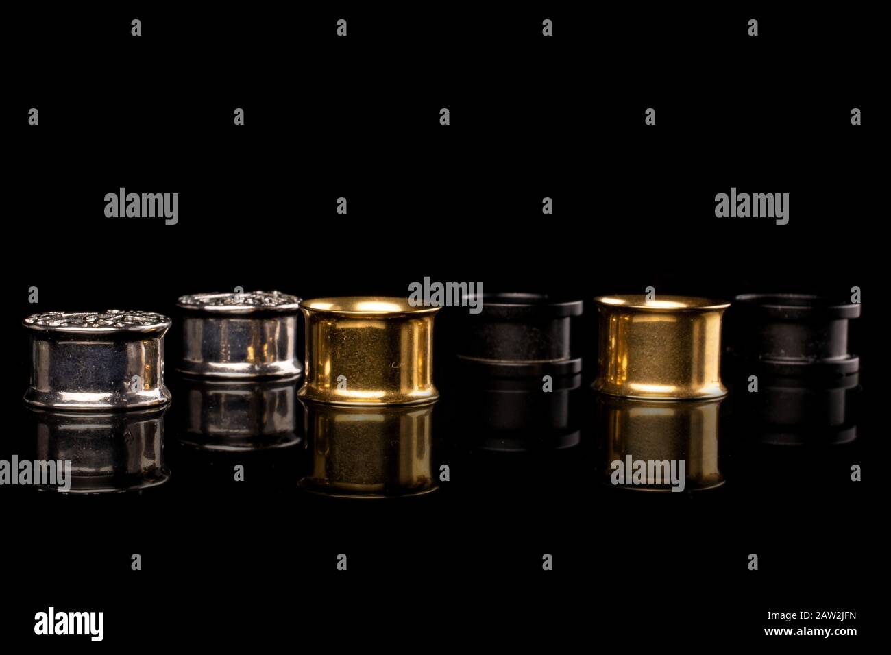 Group of six whole plug isolated on black glass Stock Photo - Alamy