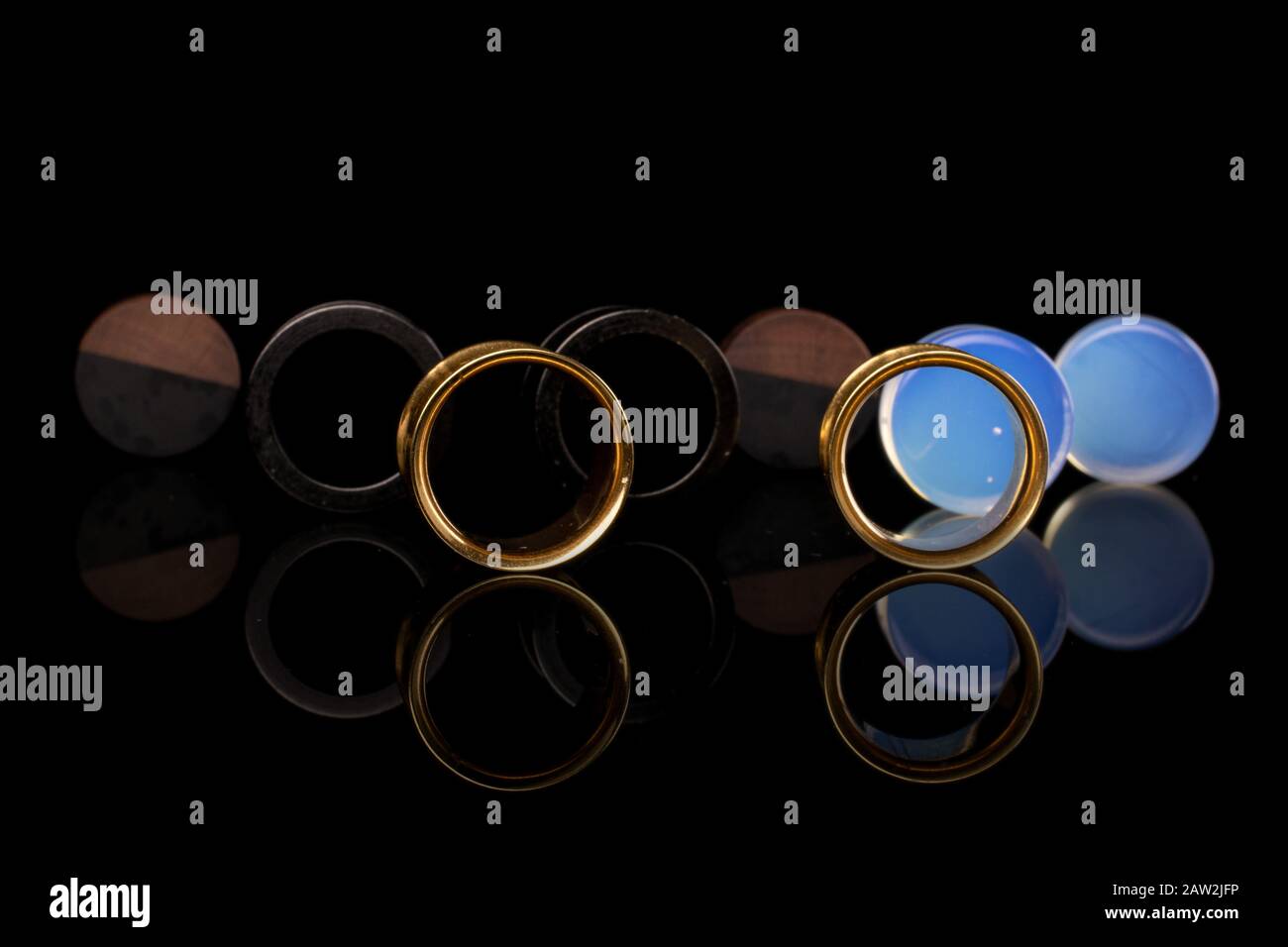 Group of eight whole plug isolated on black glass Stock Photo - Alamy