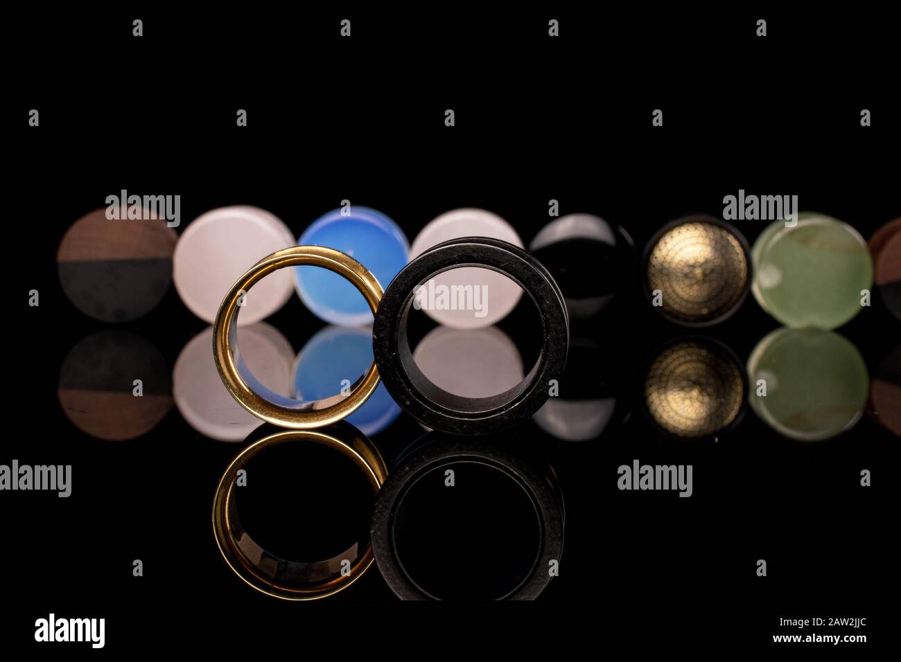 Group of ten whole plug isolated on black glass Stock Photo - Alamy